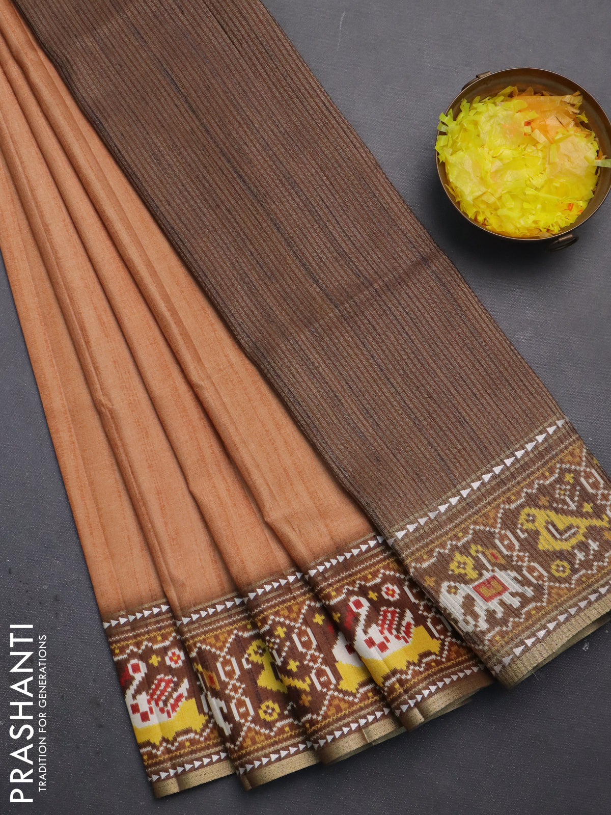 Semi tussar saree peach orange and brown with plain body and patola pr ...